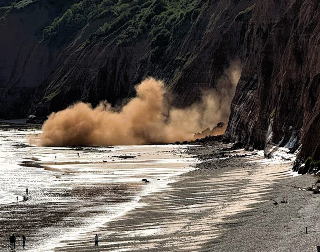 Thousands of tons of rocks plunged onto beach just yards from ...
