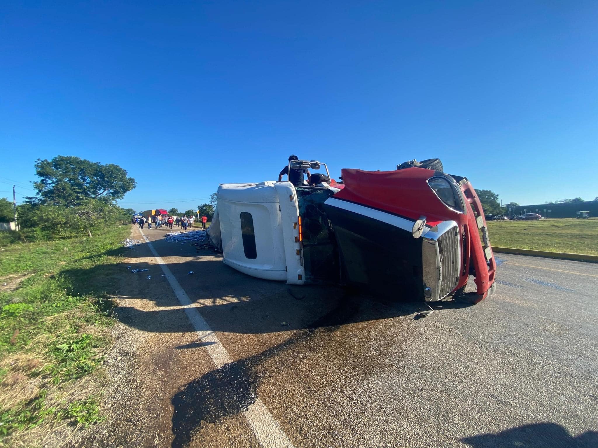 Thirsty locals seize 25 tonnes of beer cans from overturned lorry ...