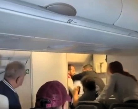 Panic as plane passenger ‘tries to open emergency exit’ during flight ...